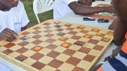 Ghana: The board game Draughts is one of the popular pastimes for men ...